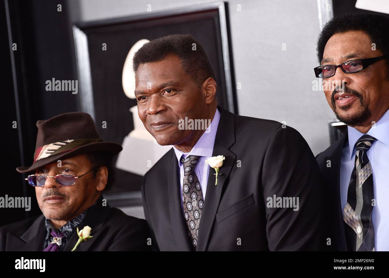 Robert Cray, center, arrives at the 60th annual Grammy Awards at ...