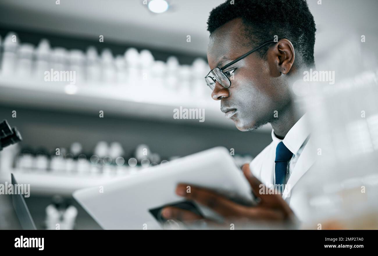 Science, laboratory and black man with tablet for research, medical analysis and experiment ...