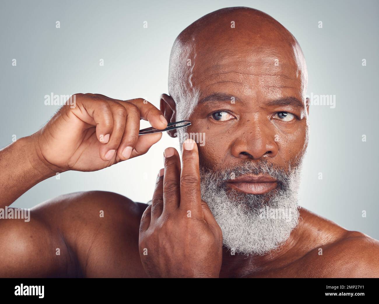 Grooming, skincare and black man with a tweezers for hair removal ...