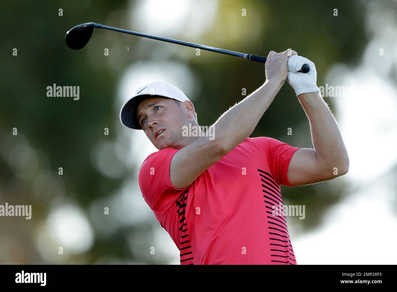 Alex Noren, of Sweden, watches his tee shot on the 18th hole of the ...