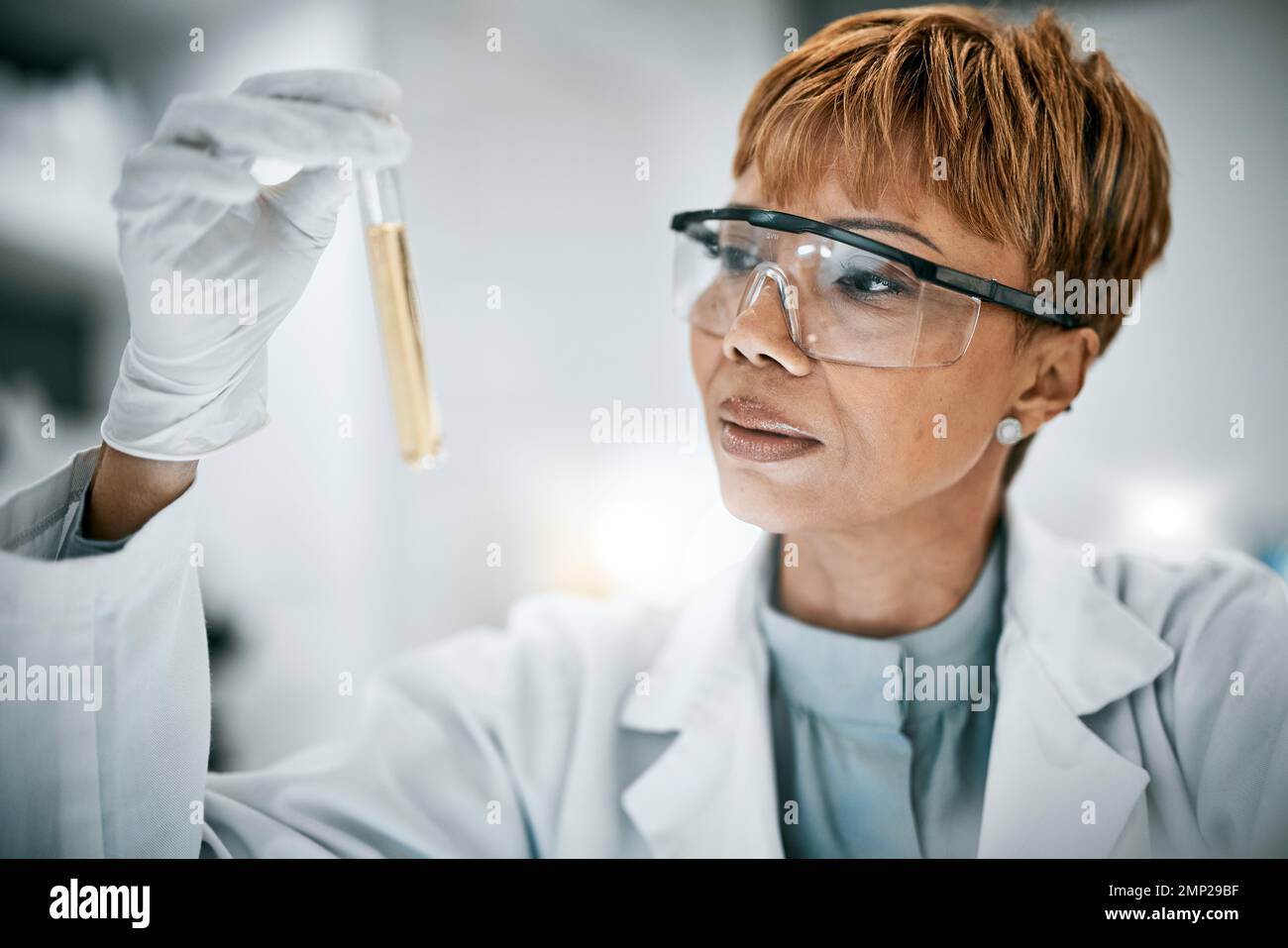 Science, test tube and black woman scientist with research, analysis ...