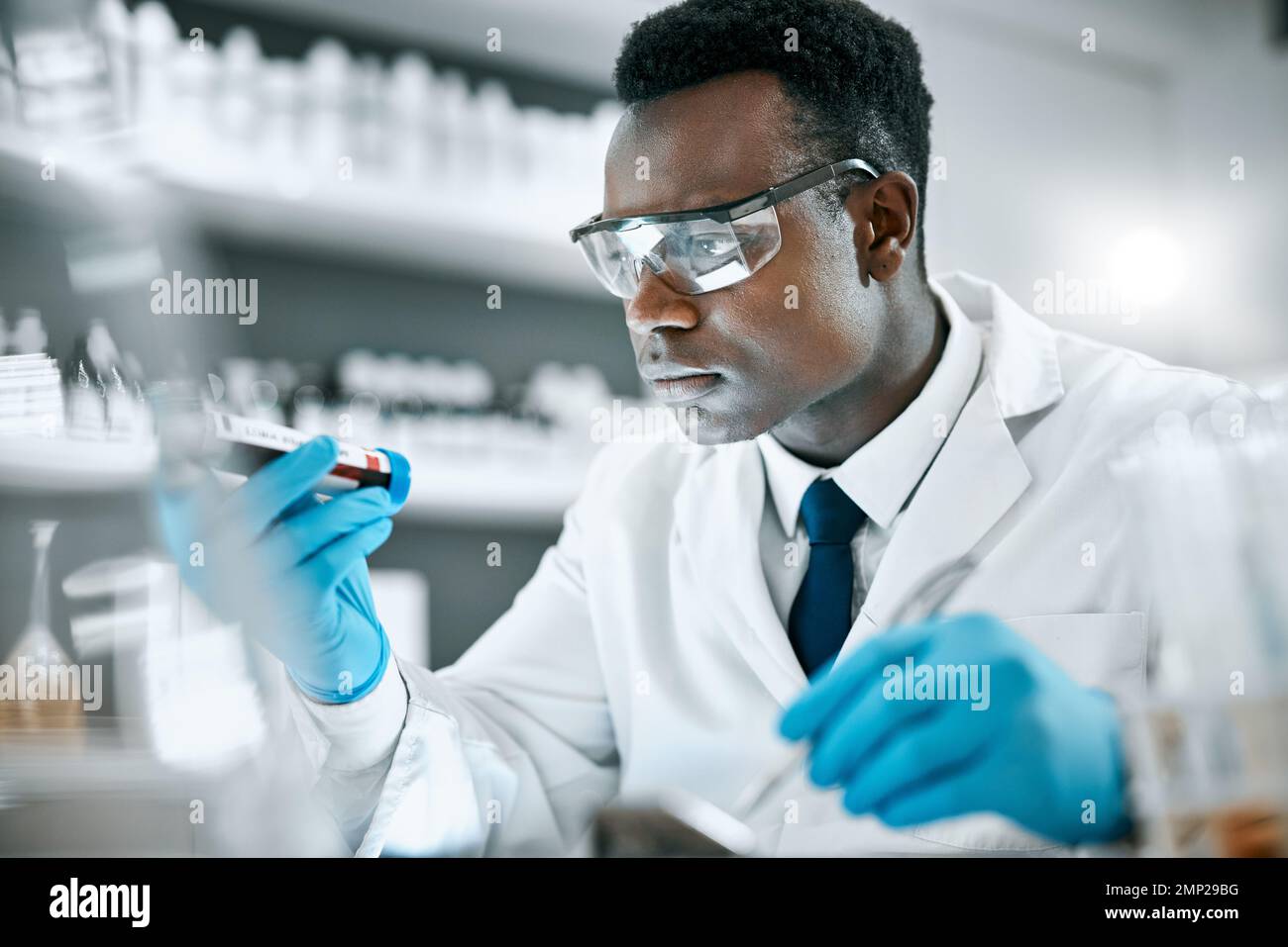 Black man, research and tube for test sample, focus and thinking for ...