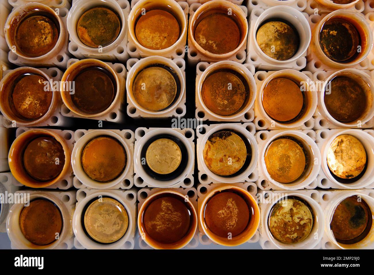 Rust-covered gold coins recovered from theS.S. Central Americasteamship ...