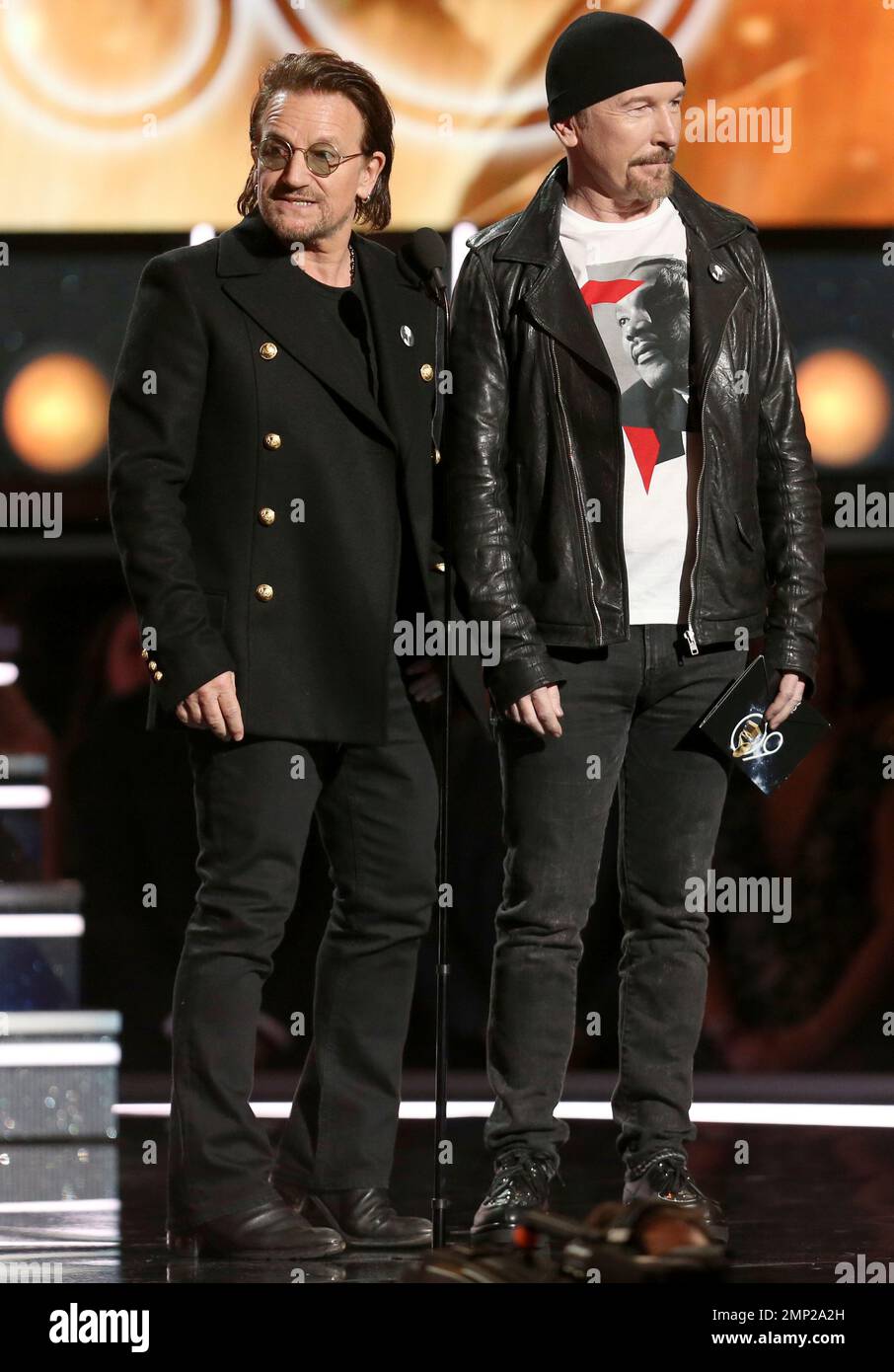 U2 present the award for album of the year at the 60th annual Grammy ...