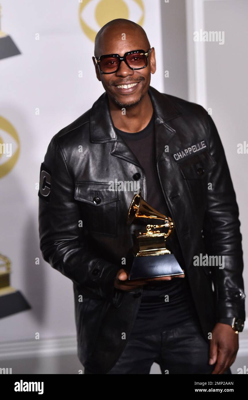 Dave Chappelle poses in the press room with the best comedy album award ...
