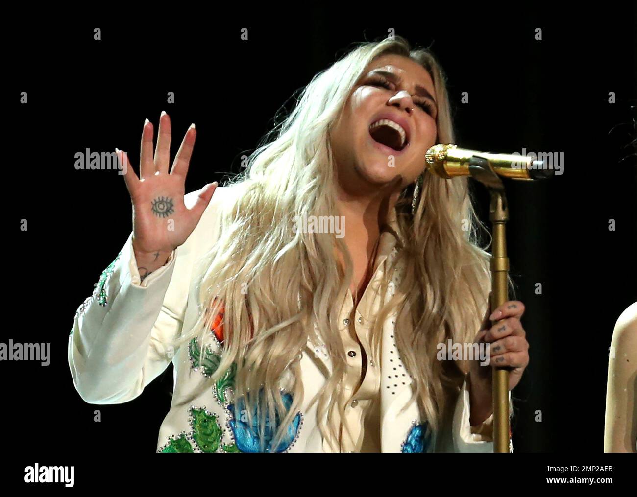 Kesha performs "Praying" at the 60th annual Grammy Awards at Madison ...