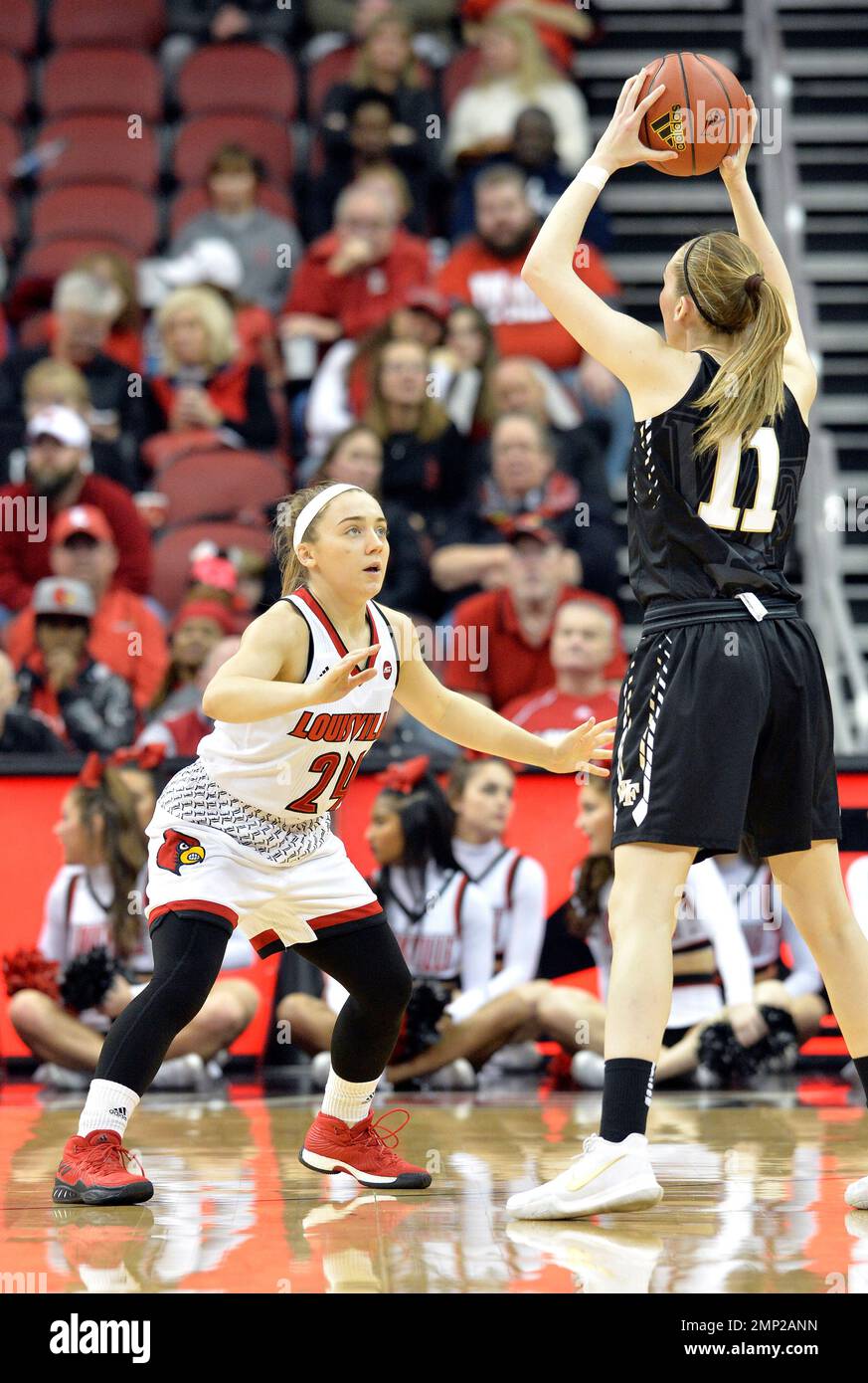 Louisville guard Jessica Laemmle (24) defends Wake Forest guard Jill ...