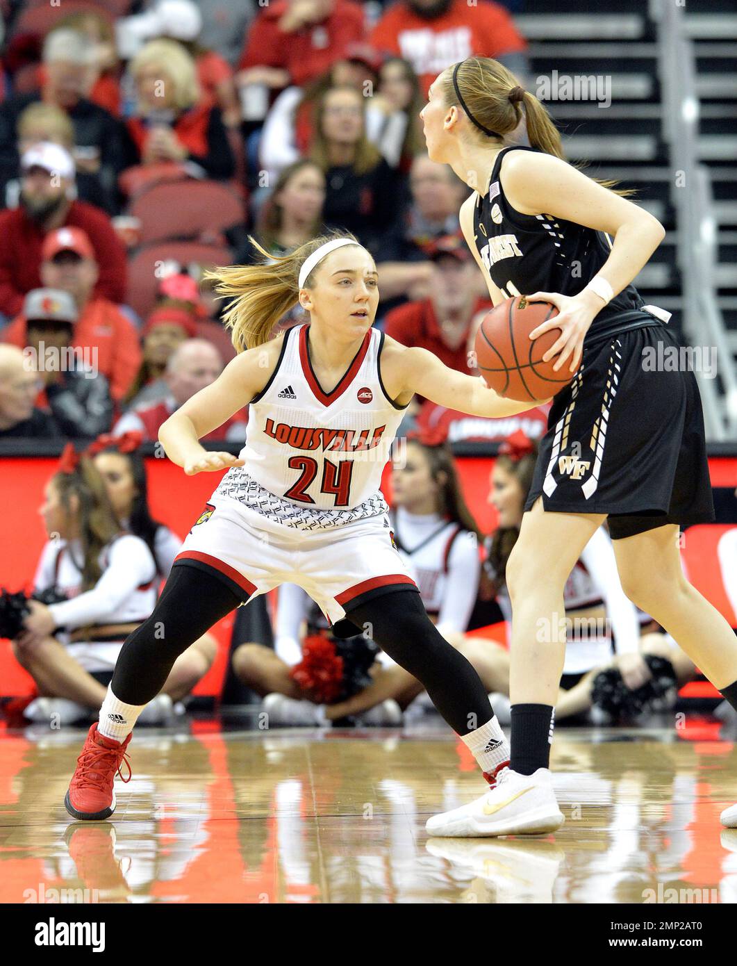 Louisville guard Jessica Laemmle (24) defends Wake Forest guard Jill ...