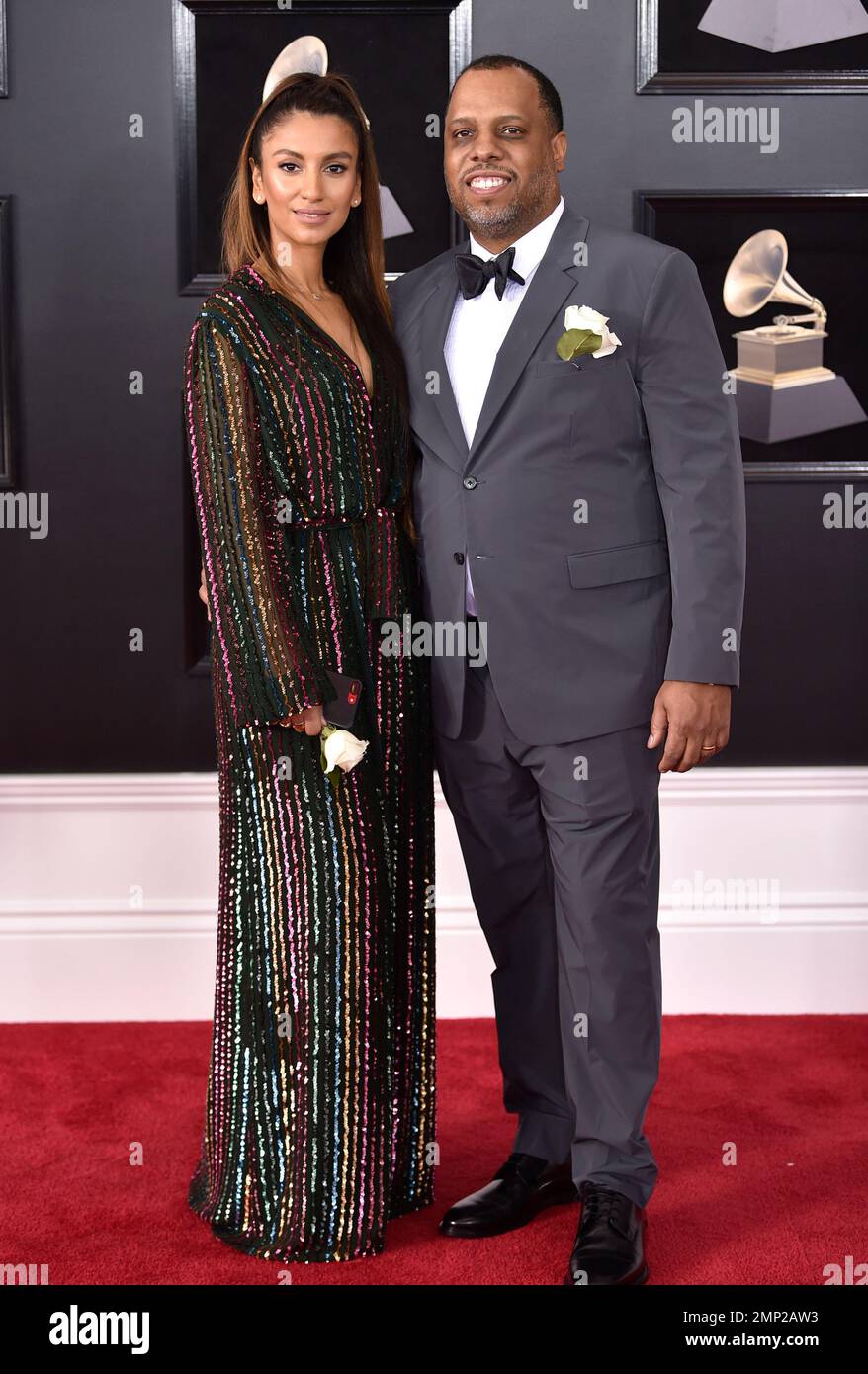 Dion "No I.D." Wilson, right, arrives at the 60th annual Grammy Awards ...