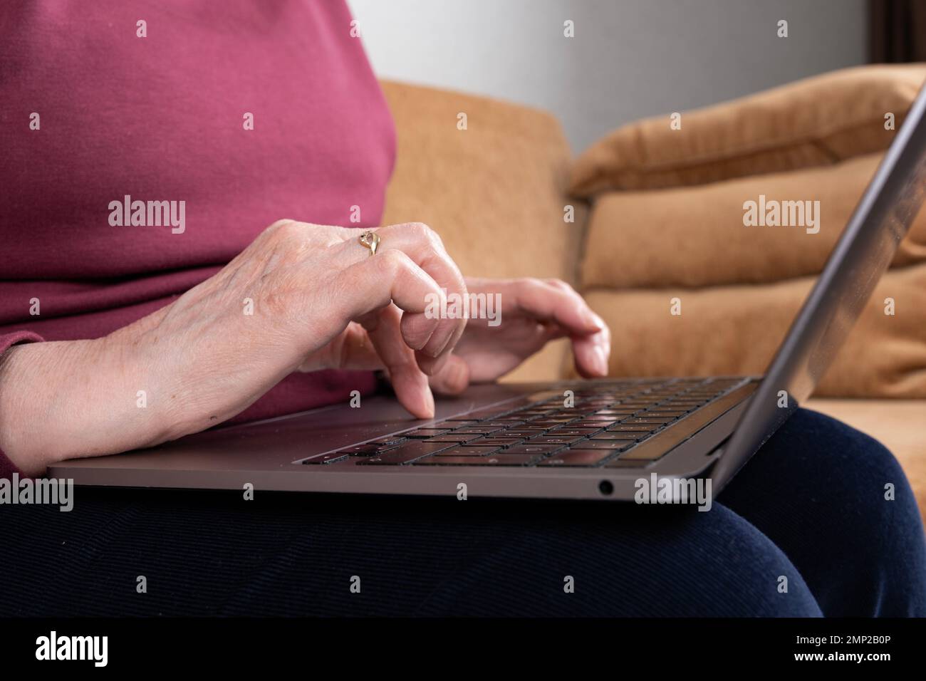 Elderly woman hands using modern laptop. Old caucasian lady finger ...