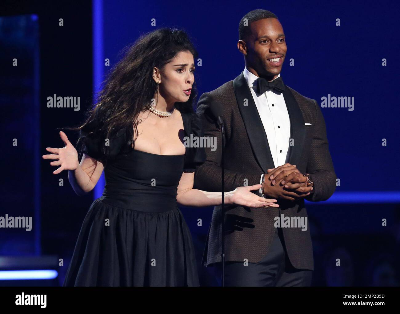 Sarah Silverman, left, and Victor Cruz introduce a performance by Luis ...