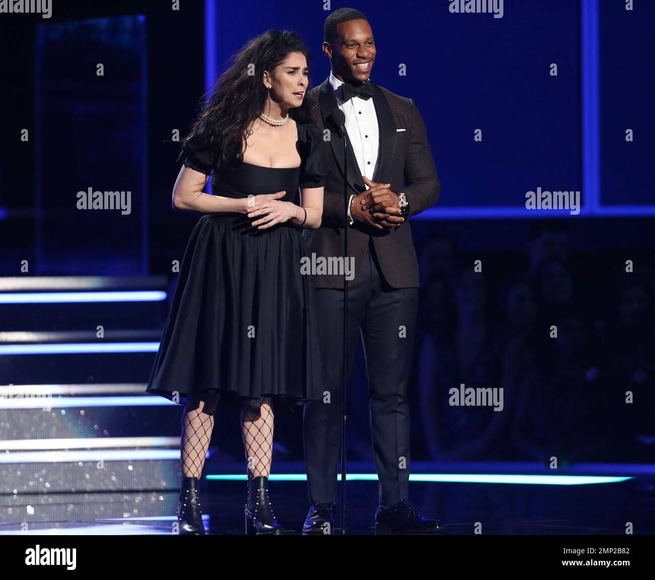 Sarah Silverman, left, and Victor Cruz introduce a performance by Luis ...