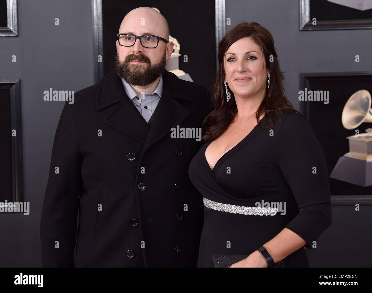 Adam Hawkins, left, arrives at the 60th annual Grammy Awards at Madison ...