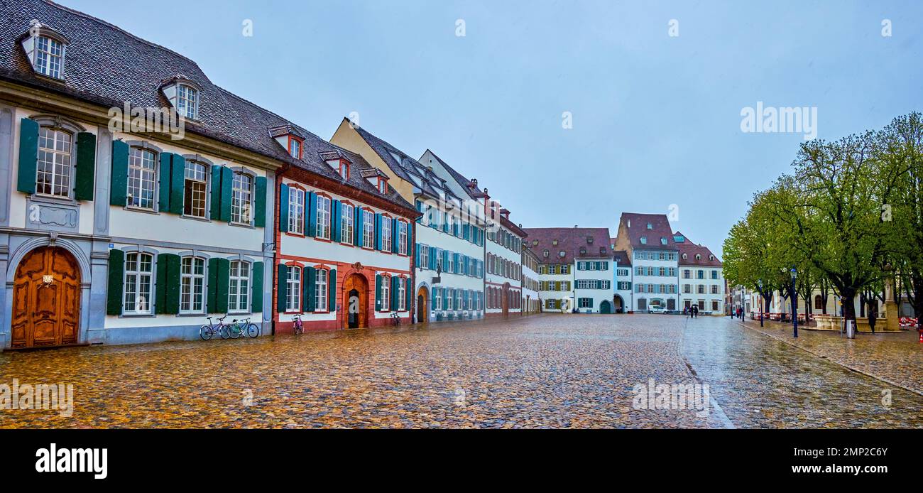 Large Munsterplatz (Minster Cathedral) square with line of traditioanl ...