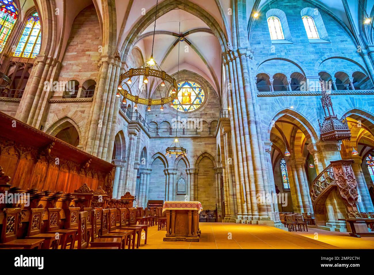 BASEL, SWITZERLAND - APRIL 1, 2022: The stone Altar and Choir chairs in ...