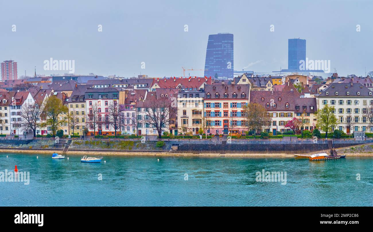 Historical riverside houses and modern office buildings on background ...