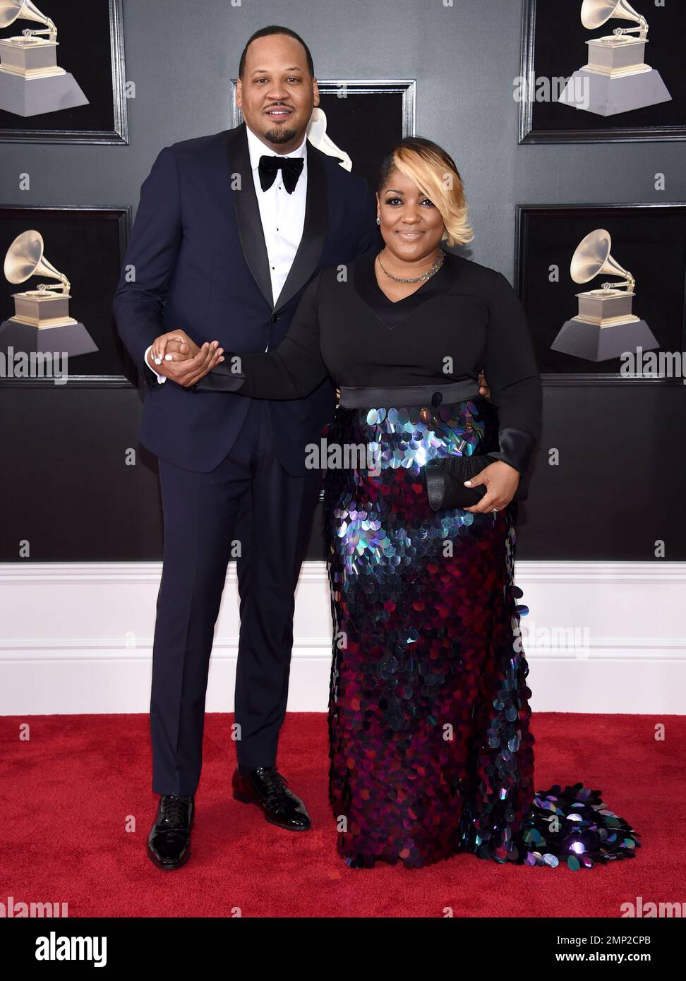 Rick Robinson, left, and Anita Wilson arrive at the 60th annual Grammy ...