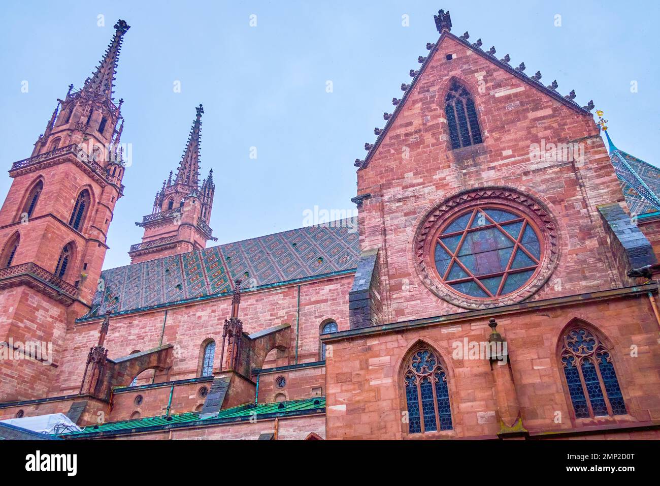 The colorful roof with bell towers and window rose on transept of Basel ...