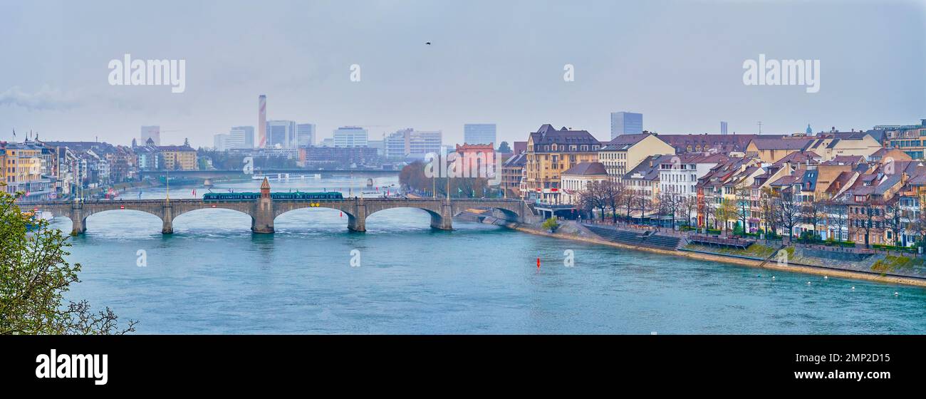 Panorama of Basel cityscape with historical riverside houses on bank of ...