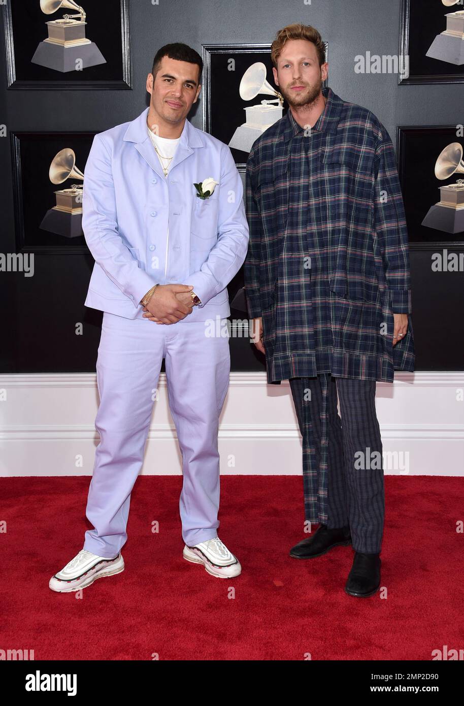 Emil Nava, left, and Burns arrive at the 60th annual Grammy Awards at ...