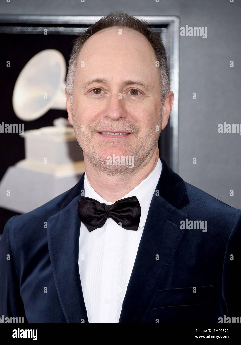Tom MacDougall arrives at the 60th annual Grammy Awards at Madison ...