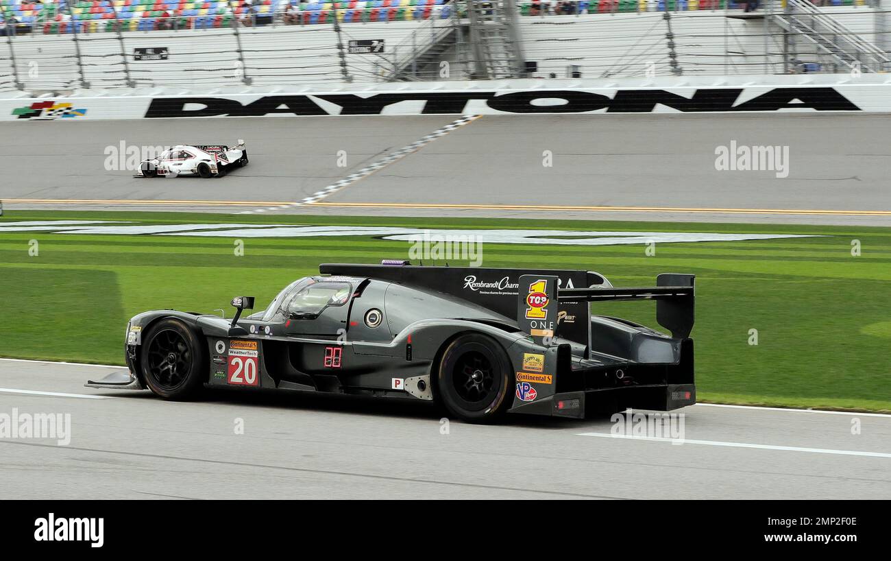 The Multimatic/Riley LMP2 (20) heads down pit road to get back on the ...