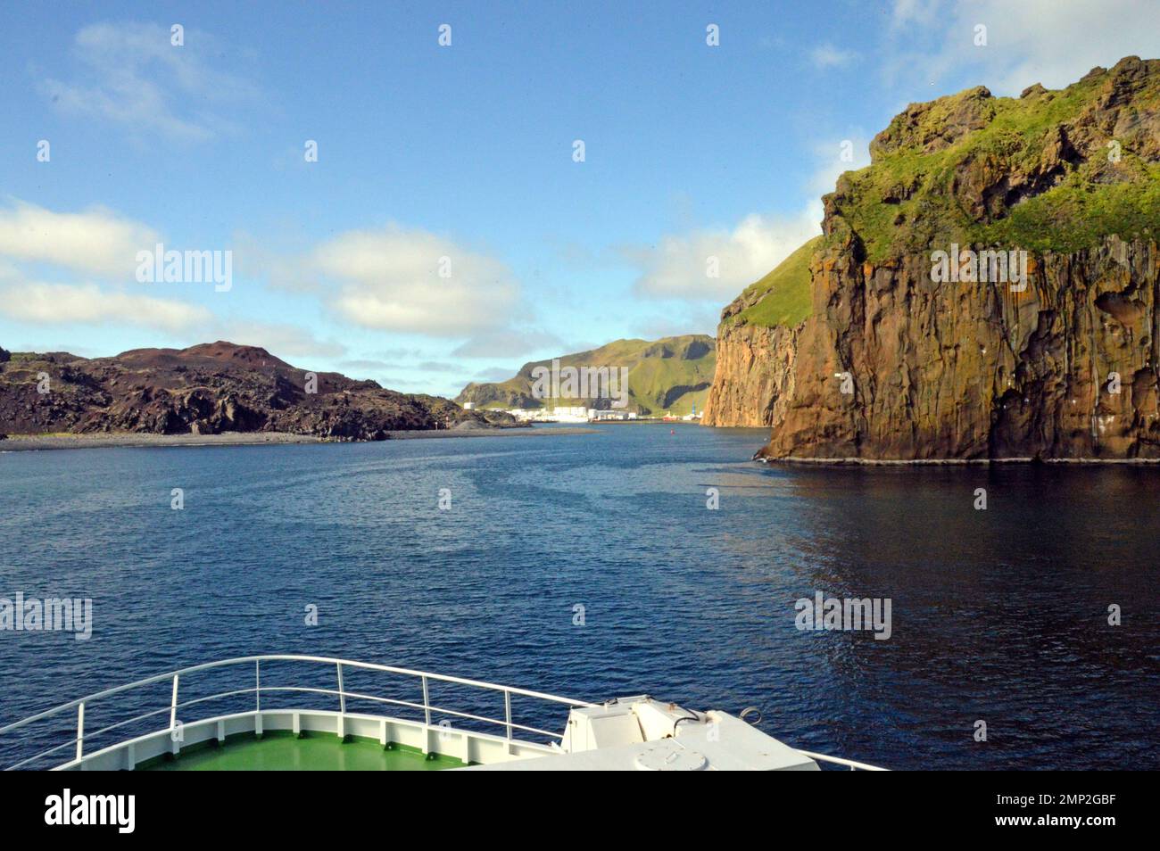 Iceland, Island of Heimaey: entrance to the harbour channel. It is the ...