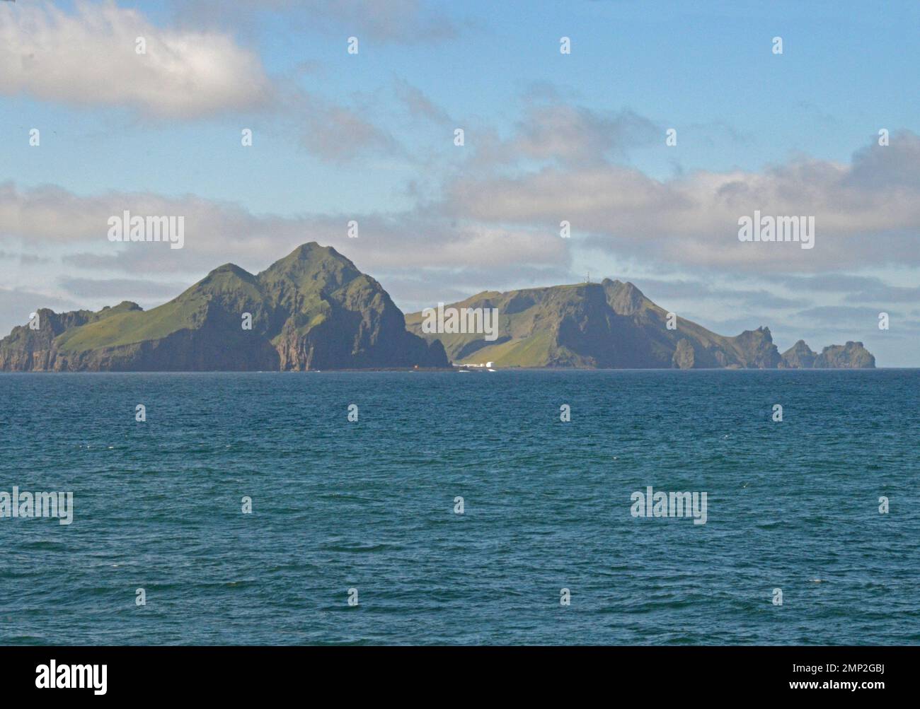 Iceland, Island of Heimaey: view from the ferry. It is the largest of ...