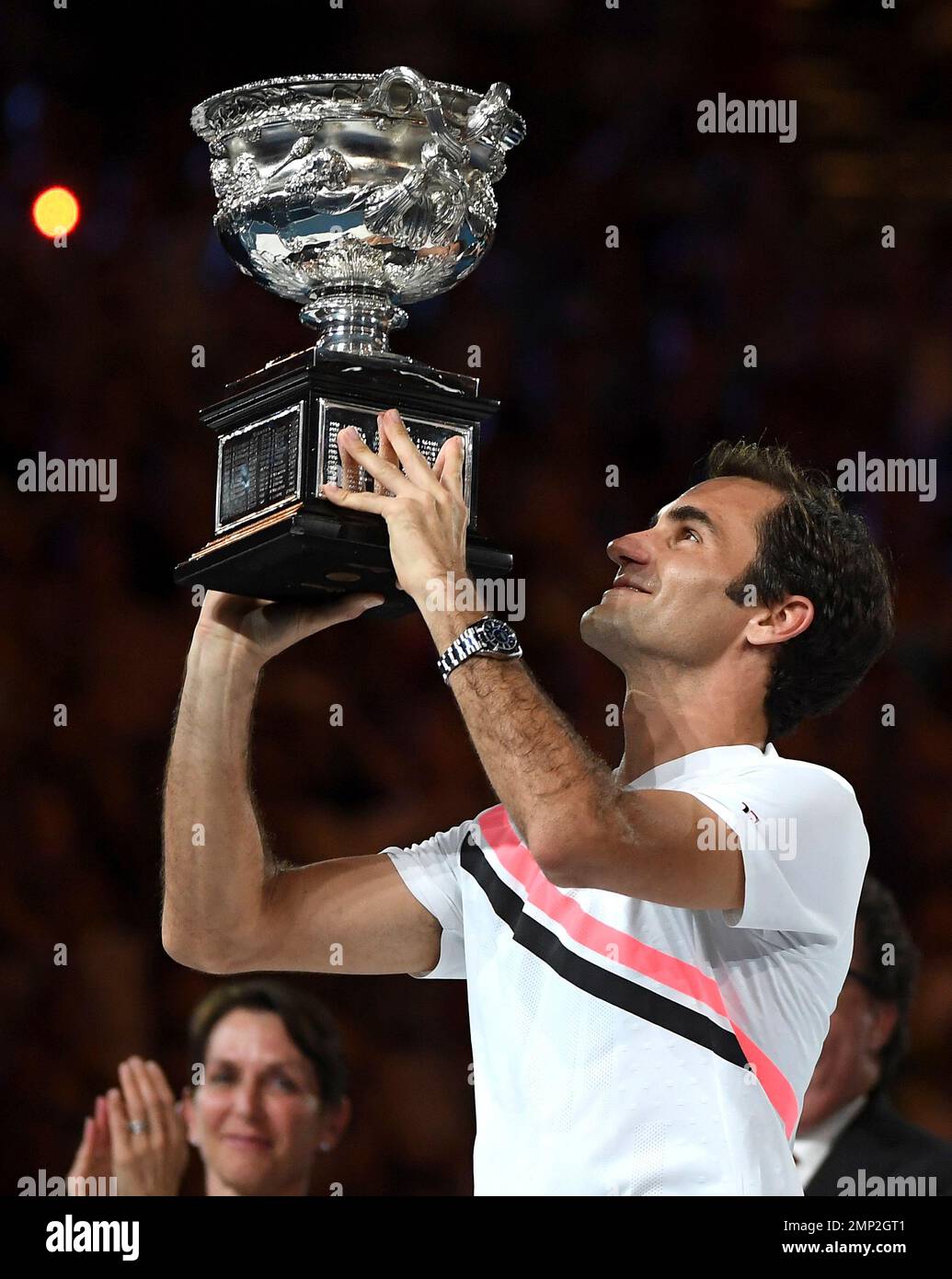 Switzerland's Roger Federer holds his trophy aloft after defeating ...