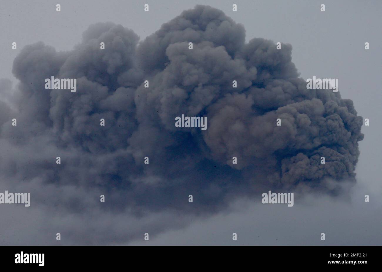 Cloud-shrouded Mayon volcano erupts anew as seen in Legazpi city, Albay ...