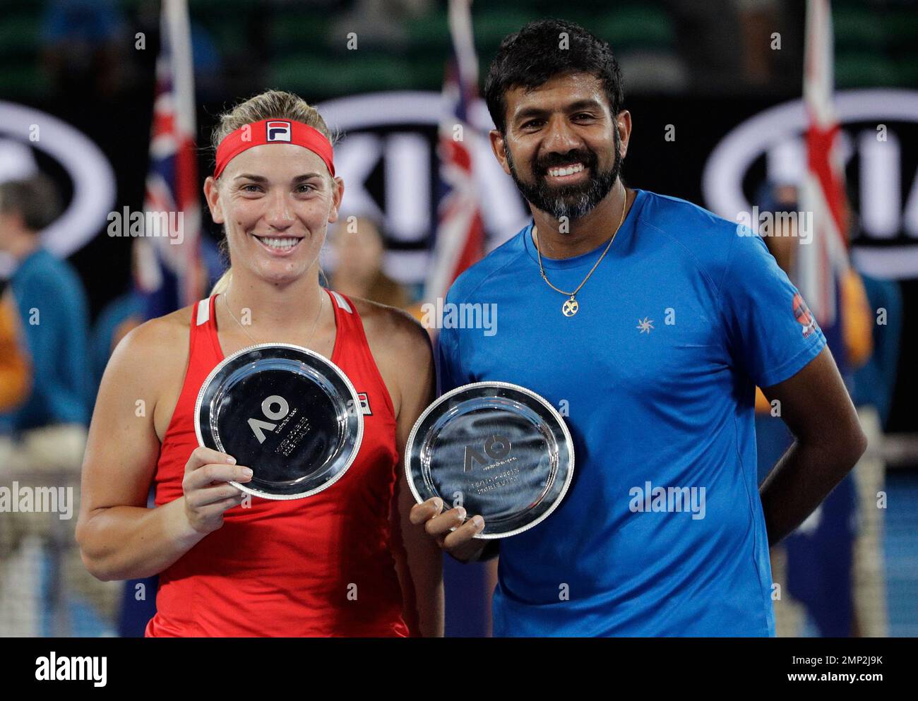 Hungary's Timea Babos, left, and partner India's Rohan Bopanna hold ...