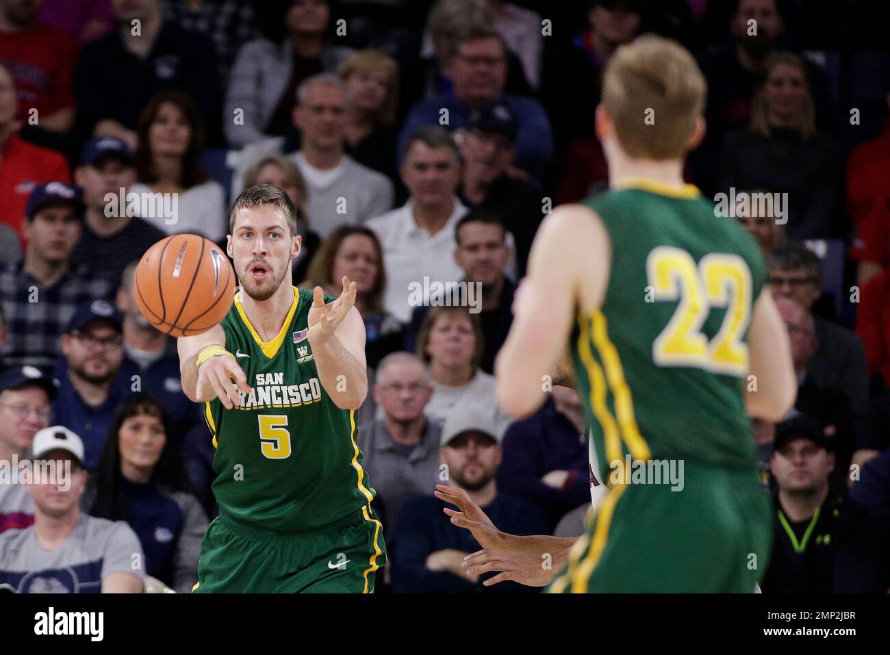 San Francisco center Jimbo Lull (5) passes the ball to forward Chase ...