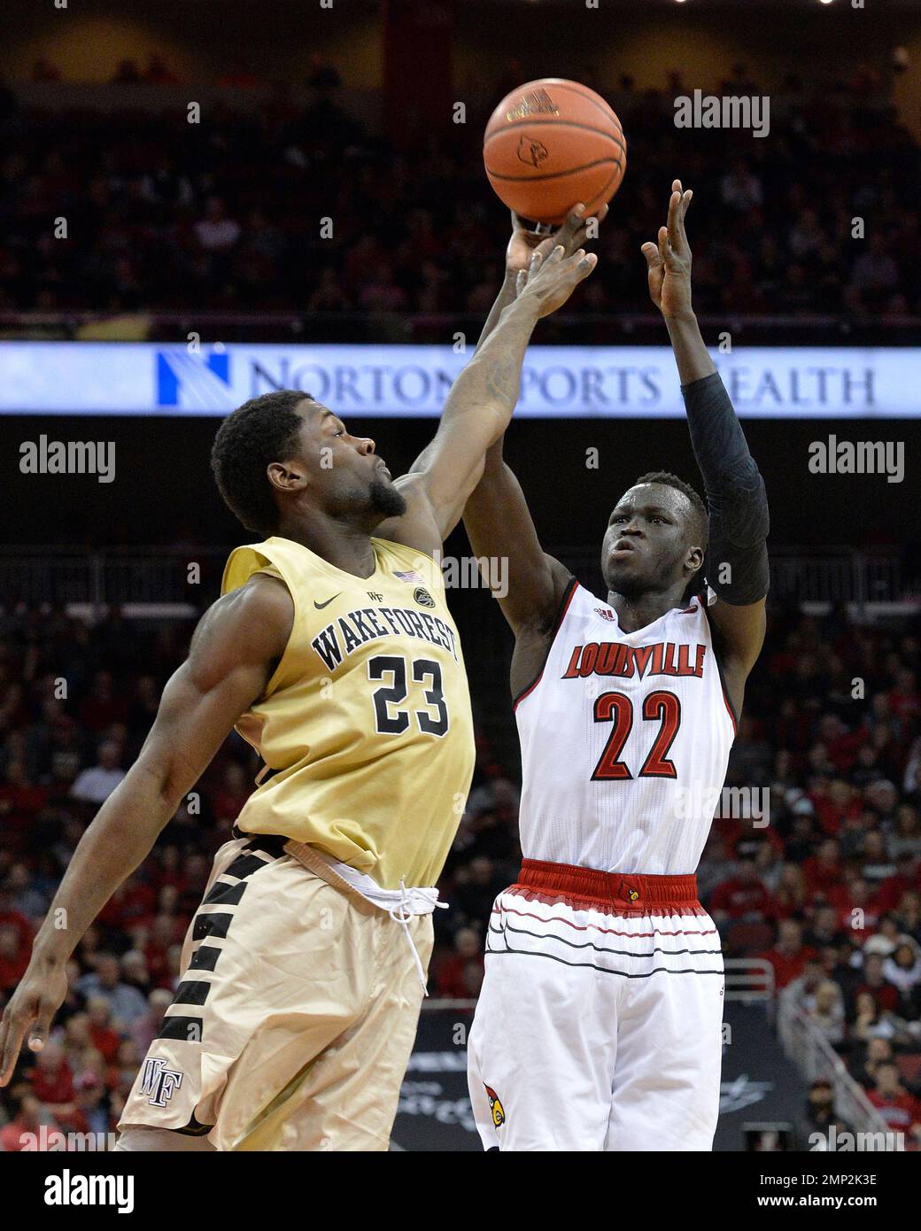 Louisville forward Deng Adel (22) shoots over Wake Forest guard ...