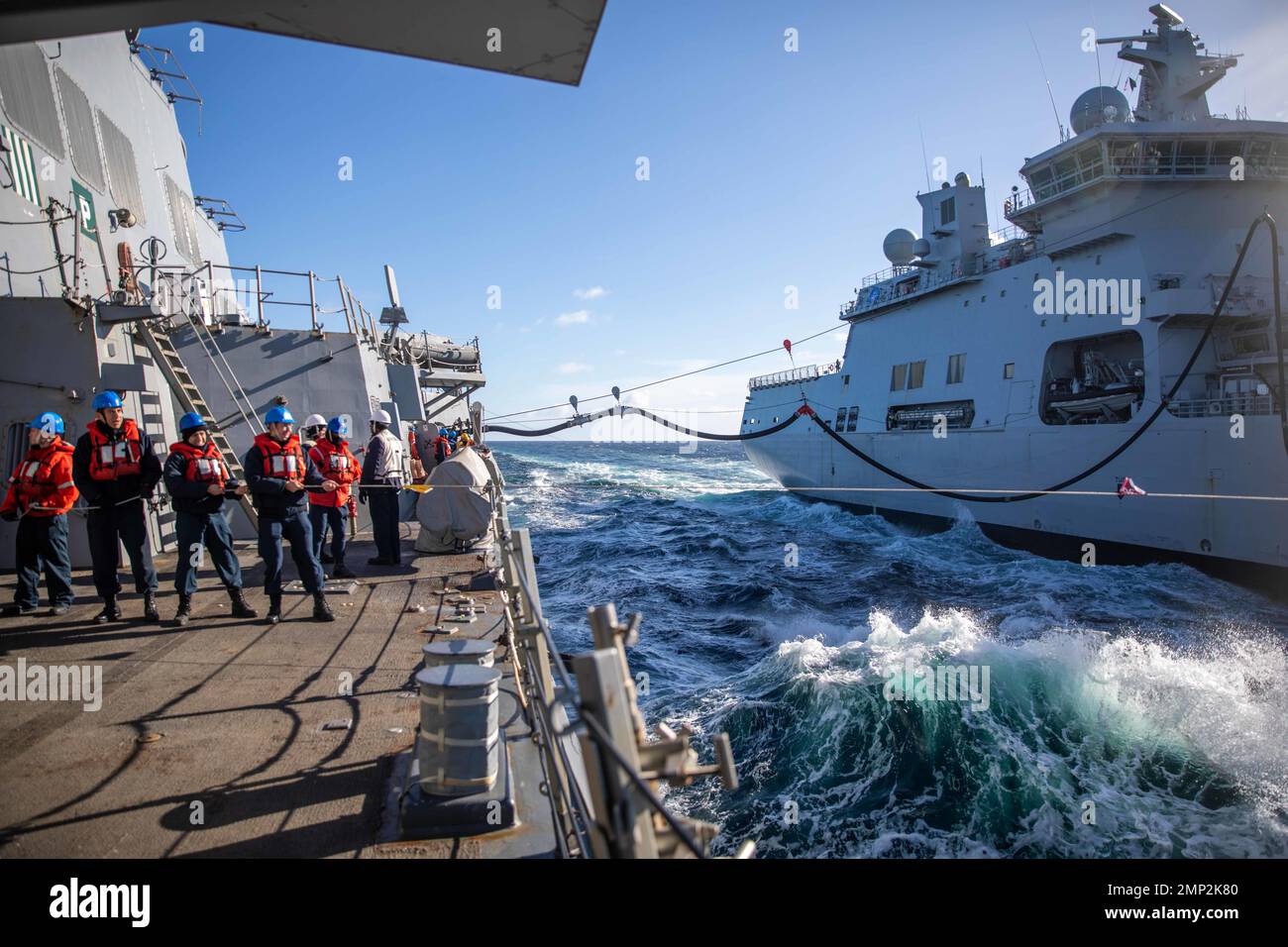 NORTH SEA (Oct. 8, 2022) Sailors hold a phone and distance line aboard ...