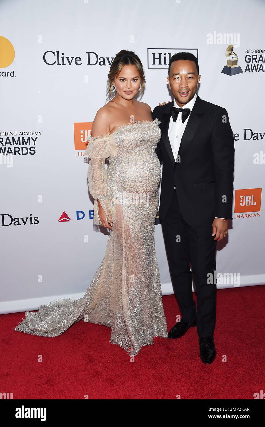 Chrissy Teigen, left, and John Legend arrive at the 2018 Pre-Grammy ...