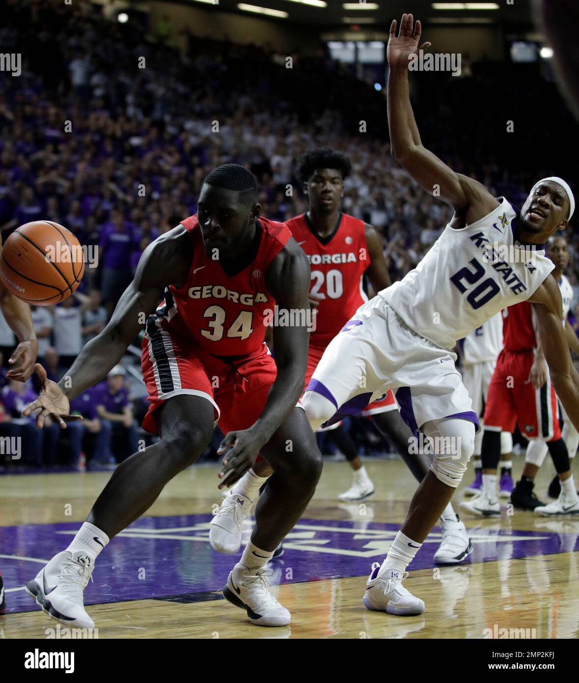Georgia forward Derek Ogbeide (34) and Kansas State forward Xavier ...