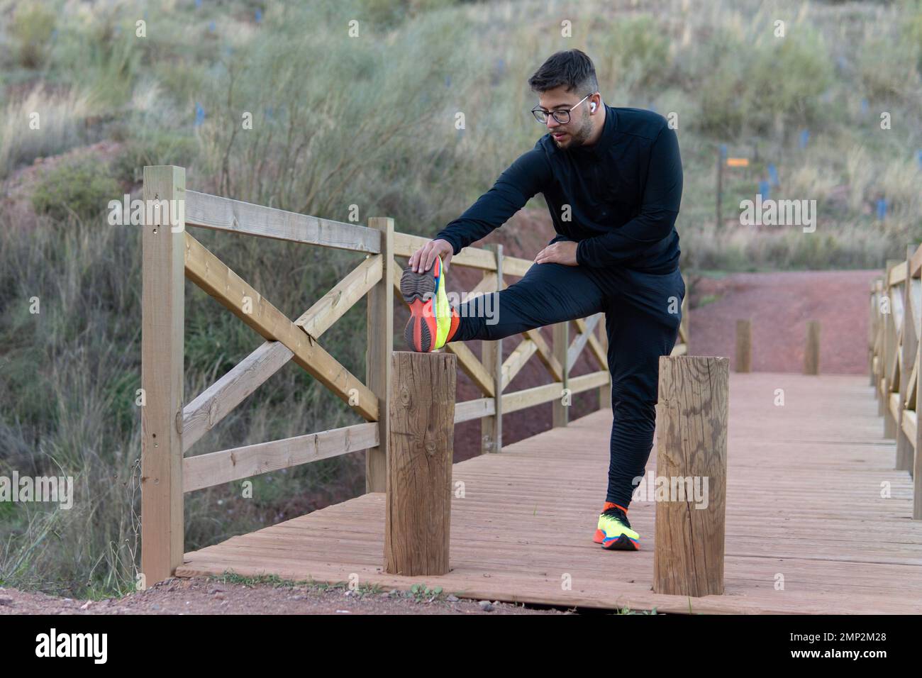 Young person stretching before starting to practice sports Stock Photo ...