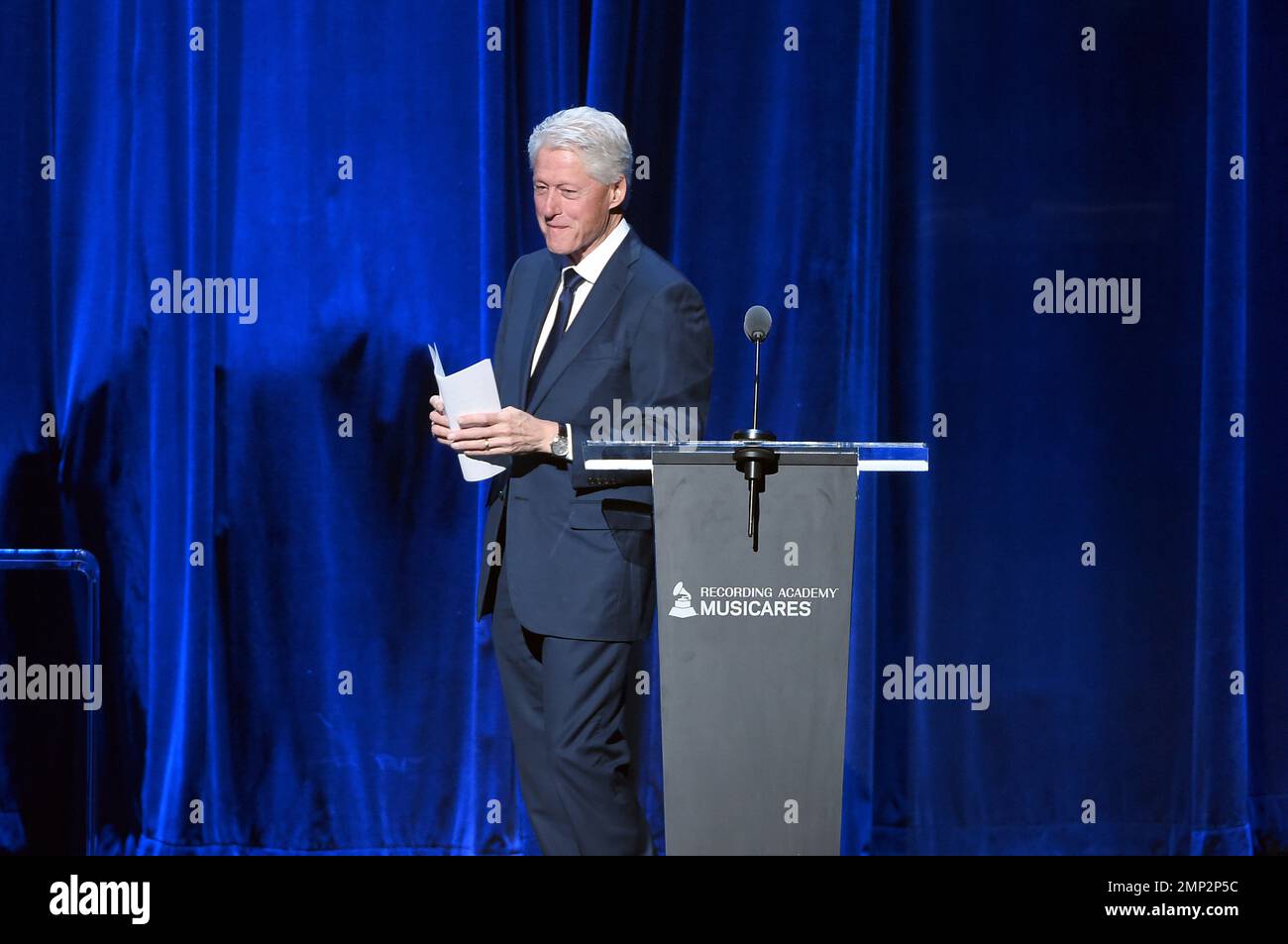 Bill Clinton speaks onstage at the 2018 MusiCares Person of the Year ...