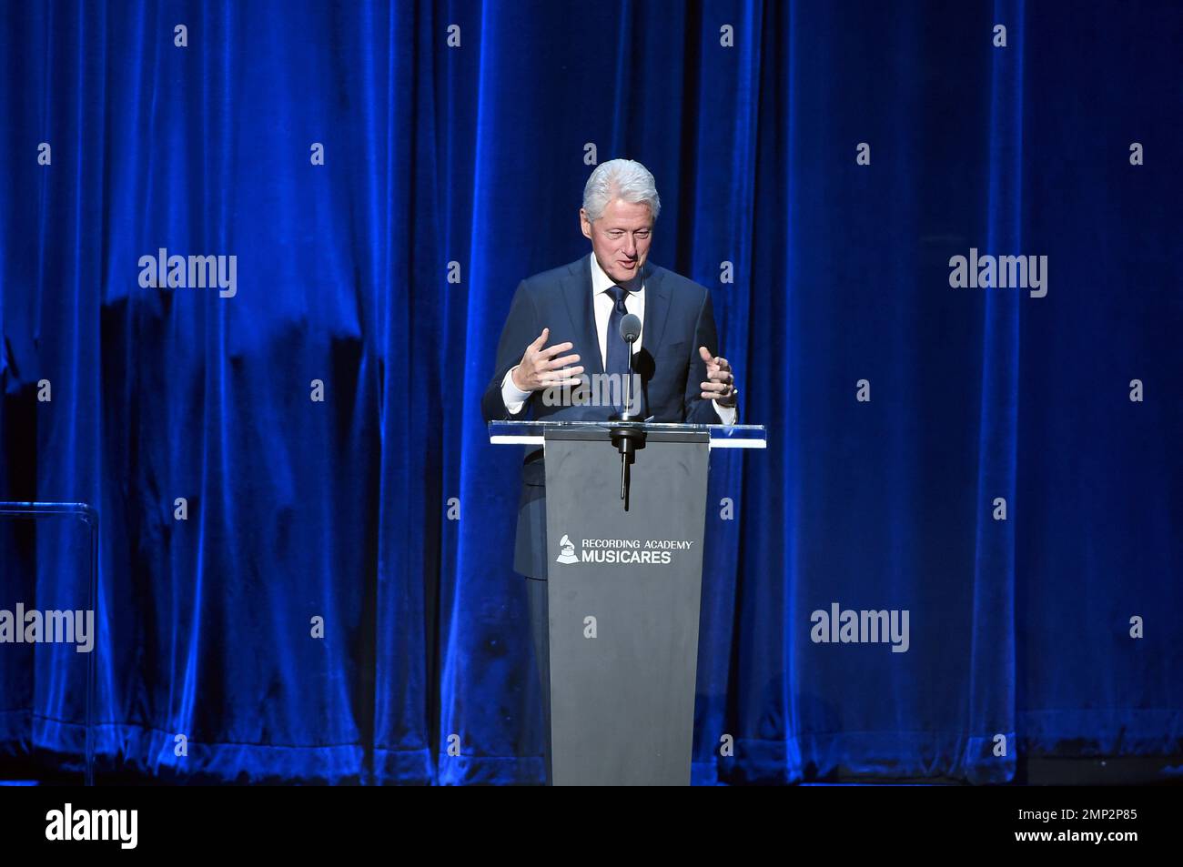 Bill Clinton speaks onstage at the 2018 MusiCares Person of the Year ...