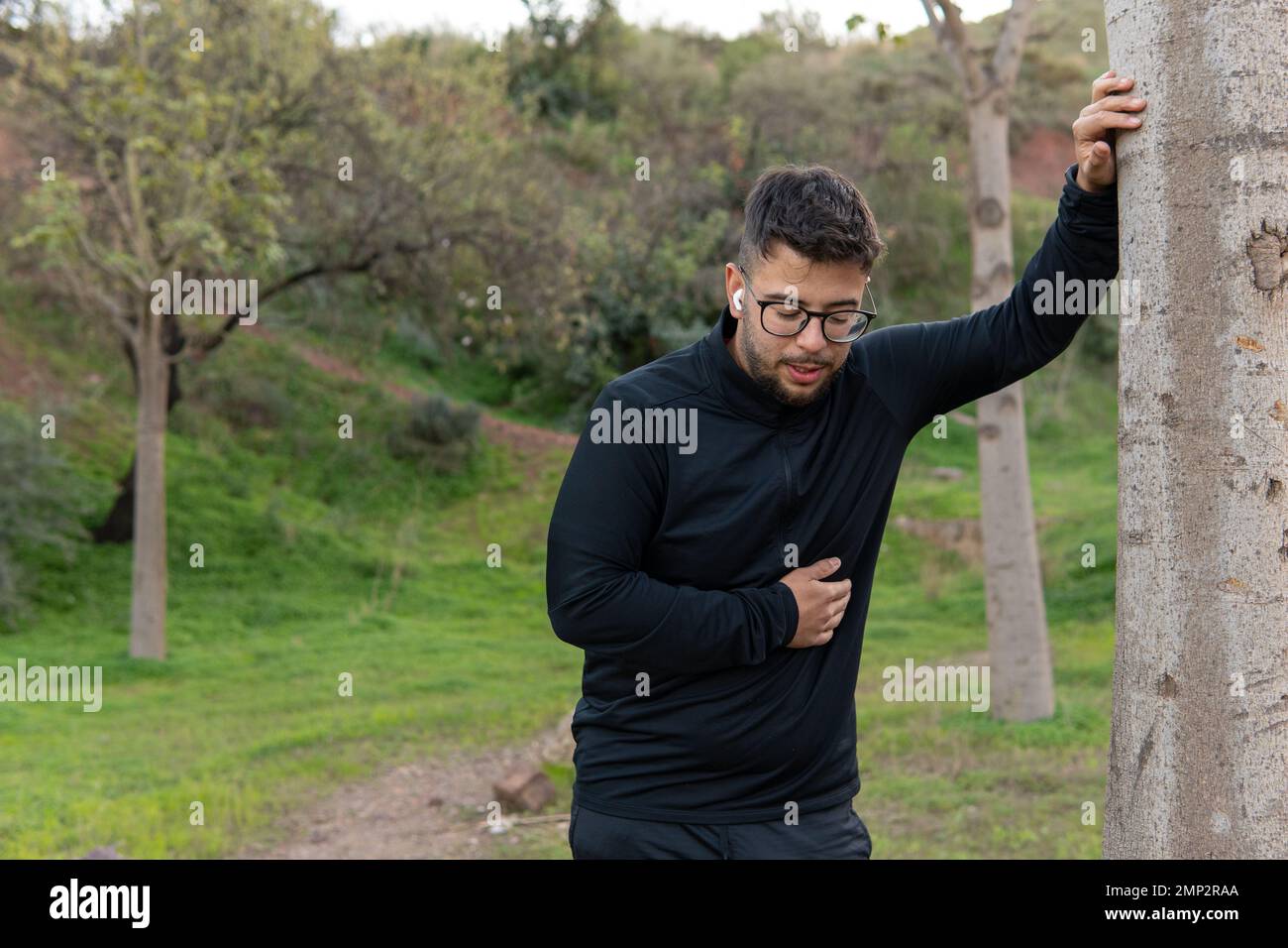 Boy taking a break after running Stock Photo - Alamy