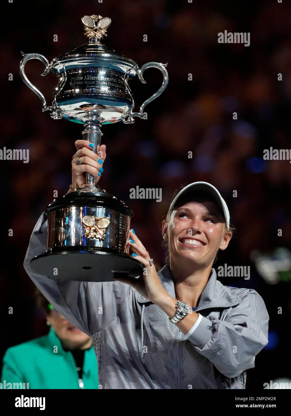 Denmarks Caroline Wozniacki Holds Her Trophy Aloft After Defeating Romanias Simona Halep In