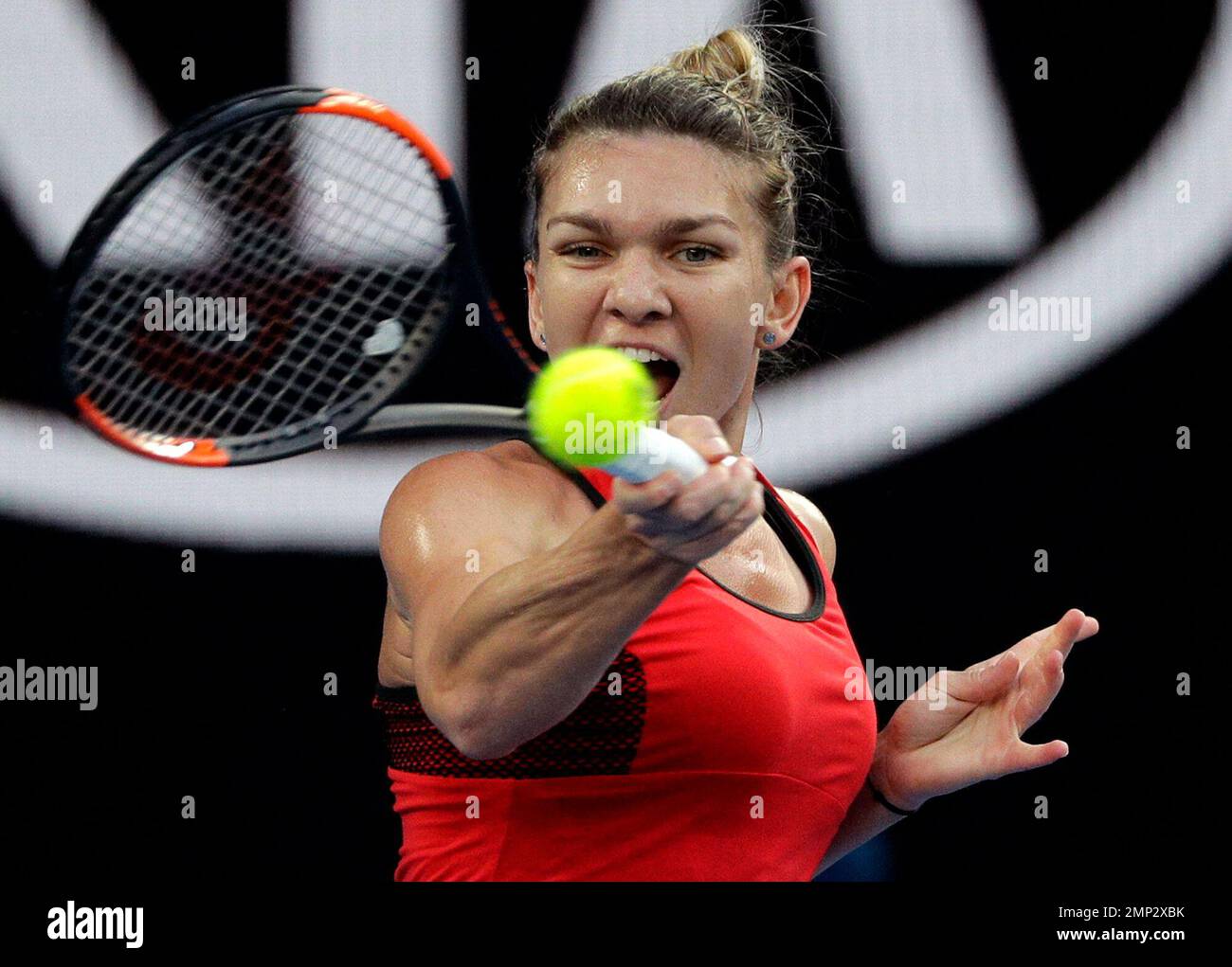 Romania's Simona Halep makes a forehand return to Denmark's Caroline ...