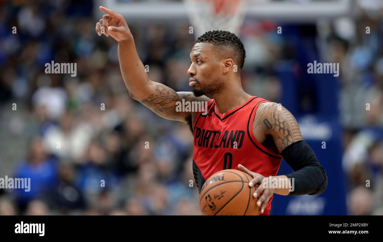 Portland Trail Blazers guard Damian Lillard (0) directs the offense ...