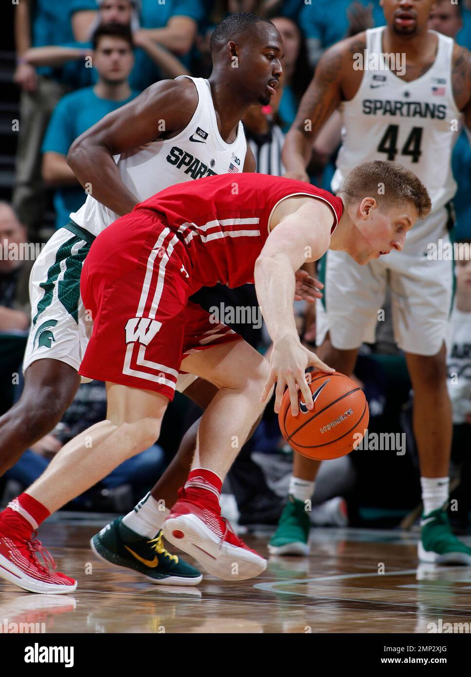 Wisconsin's Brevin Pritzl, right, drives against Michigan State's ...