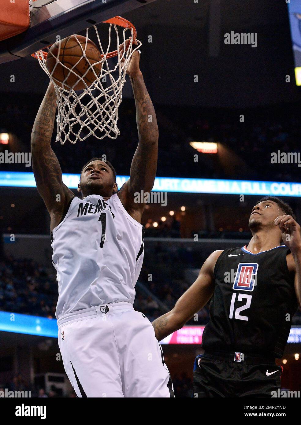 Memphis Grizzlies forward Jarell Martin (1) dunks next to Los Angeles ...