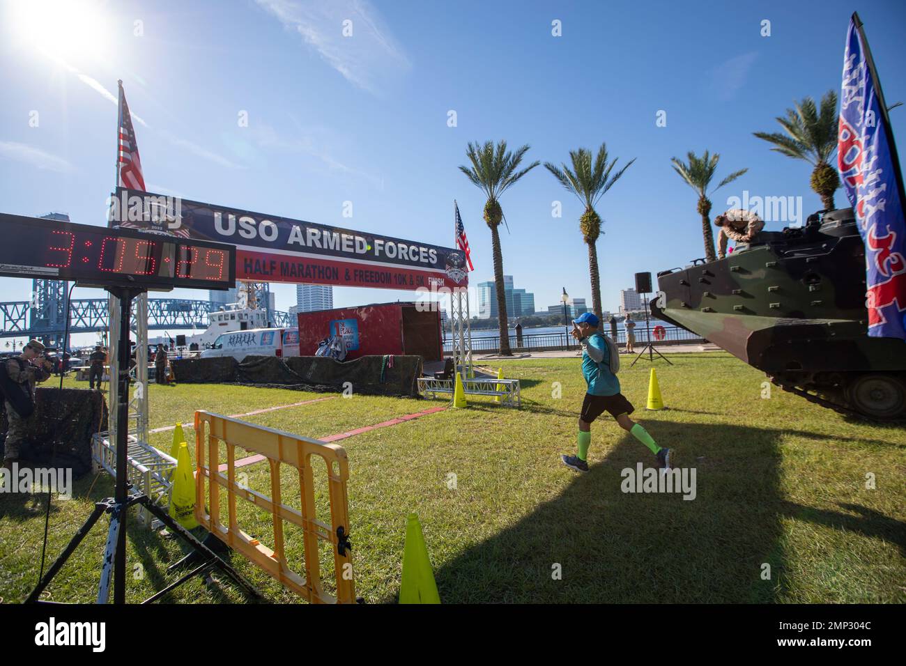 A race participant crosses the finish line during the 19th Annual USO ...