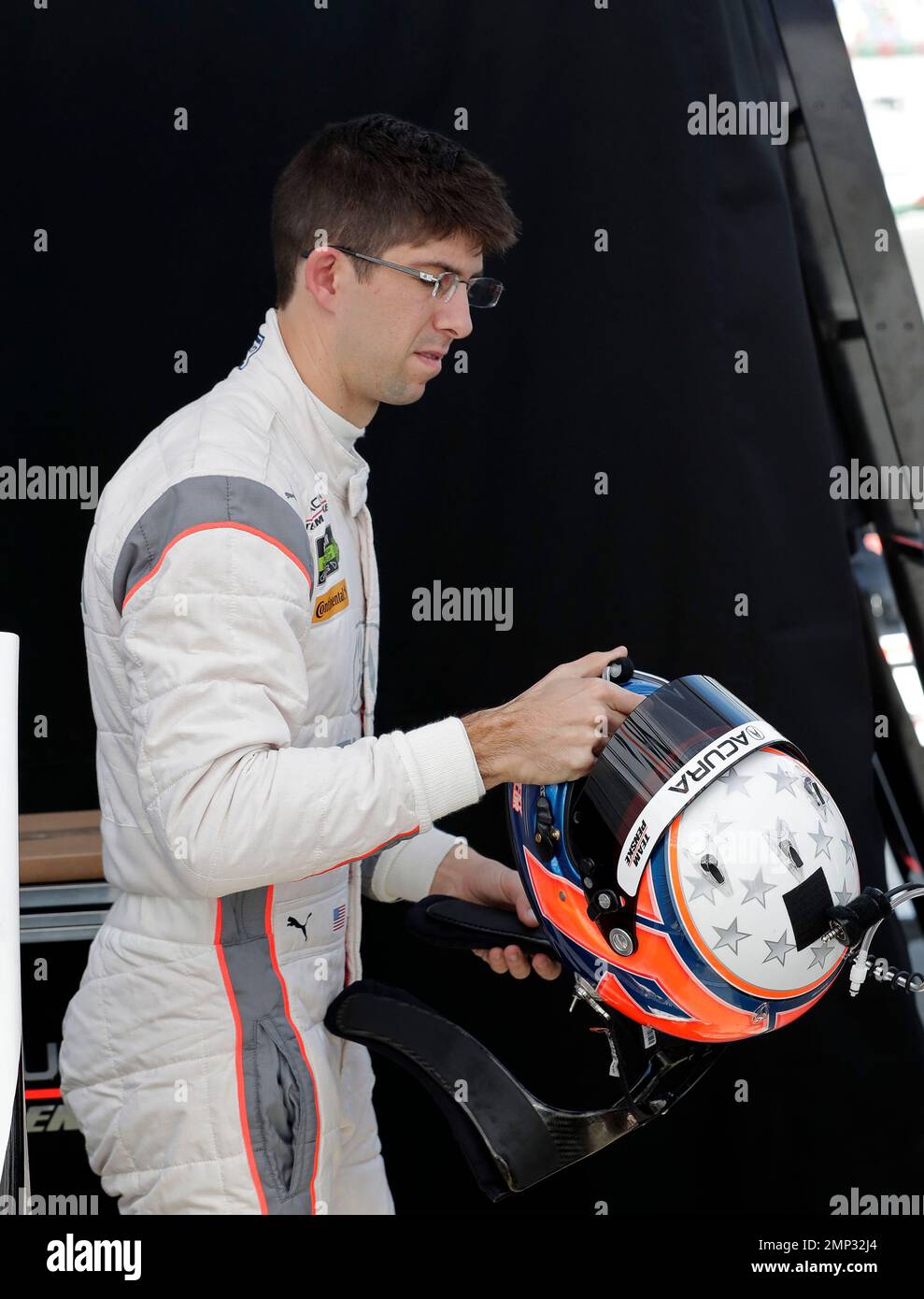 Ricky Taylor removes his helmet after taking a turn driving during ...