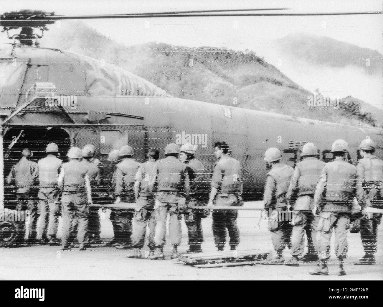 U.S. Naval corpsmen line up at Khe Sanh base, Feb. 6, 1968, to received ...