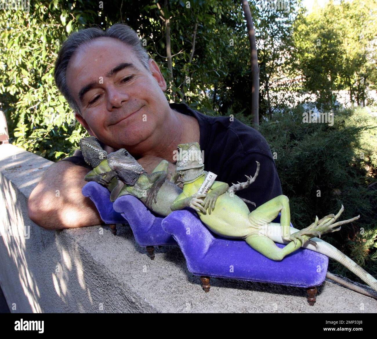 Exclusive!! Henry Lizardlover snuggles up with some of his lizard ...