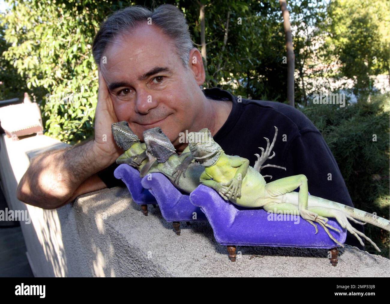Exclusive!! Henry Lizardlover snuggles up with some of his lizard ...